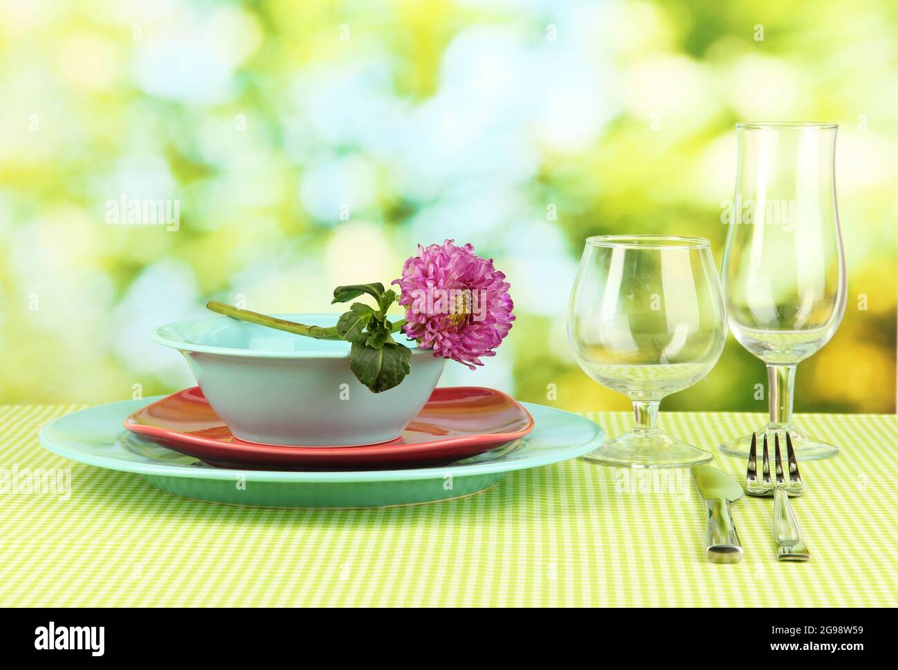 Table setting on bright background close-up Stock Photo - Alamy