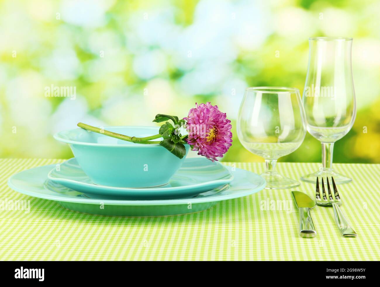 Table setting on bright background close-up Stock Photo - Alamy