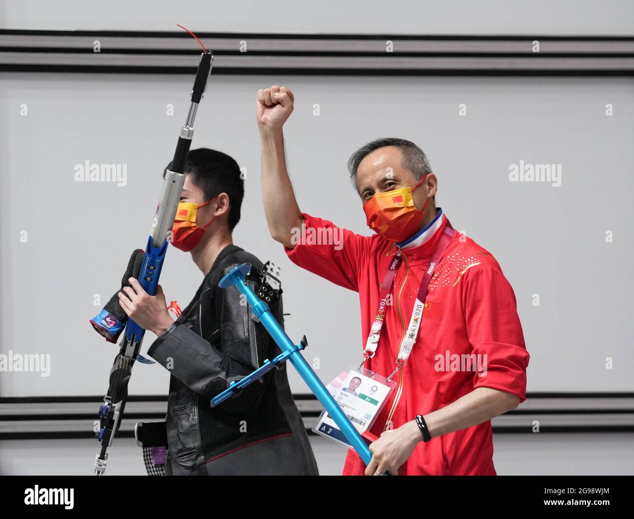 Tokyo, Japan. 25th July, 2021. Sheng Lihao (L) of China and his coach ...