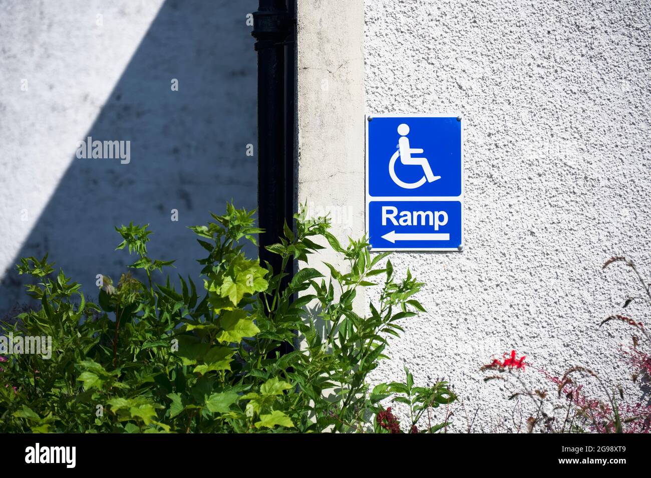 Ramp access for disabled wheelchair users sign at entrance Stock Photo ...