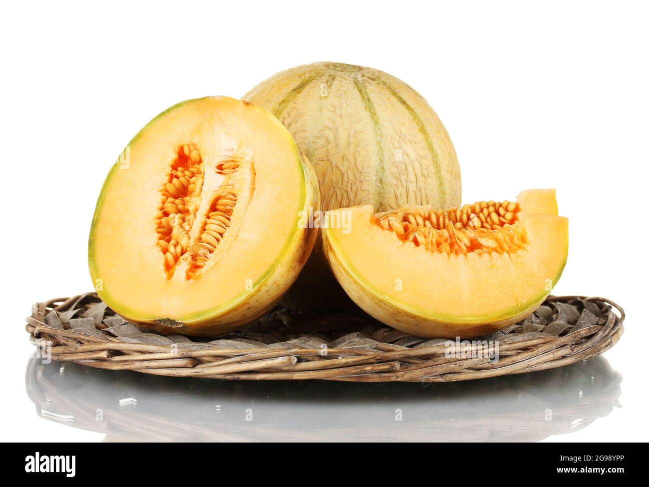 cut melon on wicker mat isolated on white Stock Photo - Alamy