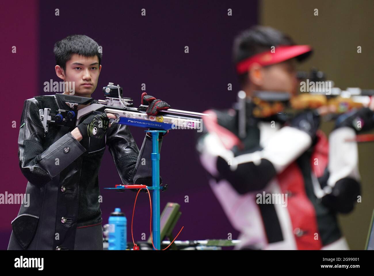 Tokyo, Japan. 25th July, 2021. Sheng Lihao (L) of China reacts during ...