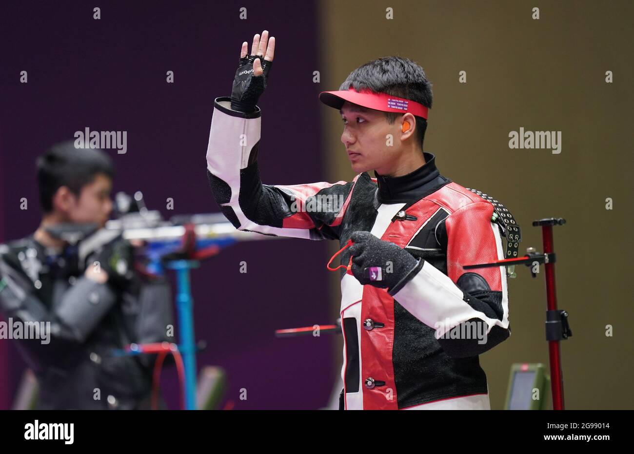 Tokyo, Japan. 25th July, 2021. Yang Haoran (front) of China reacts ...