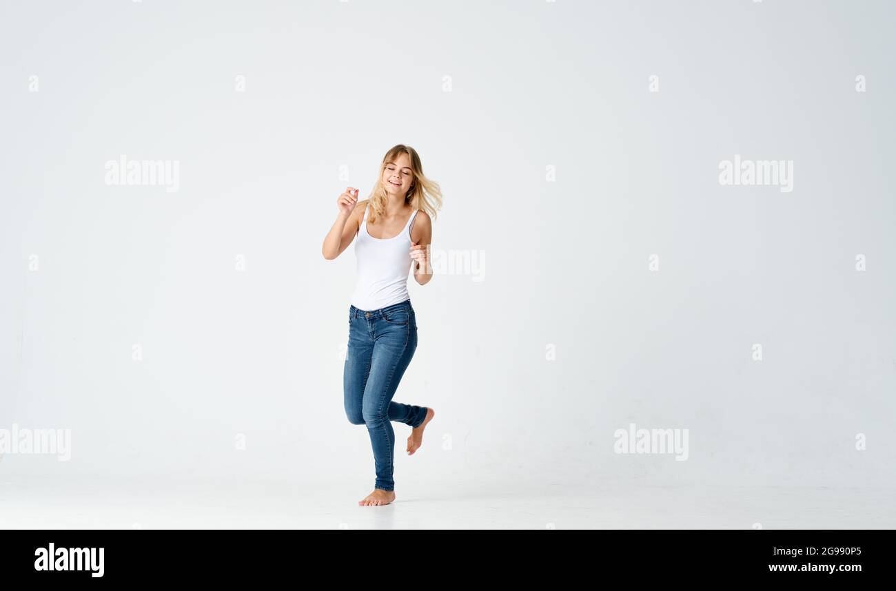 pretty woman in jeans barefoot movement posing emotions model Stock ...
