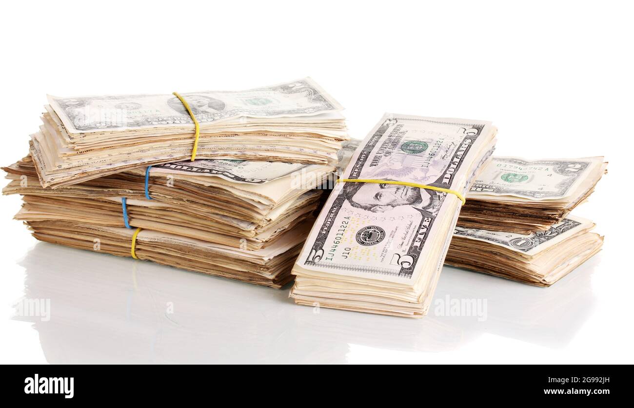 Stacks of dollars isolated on white Stock Photo - Alamy