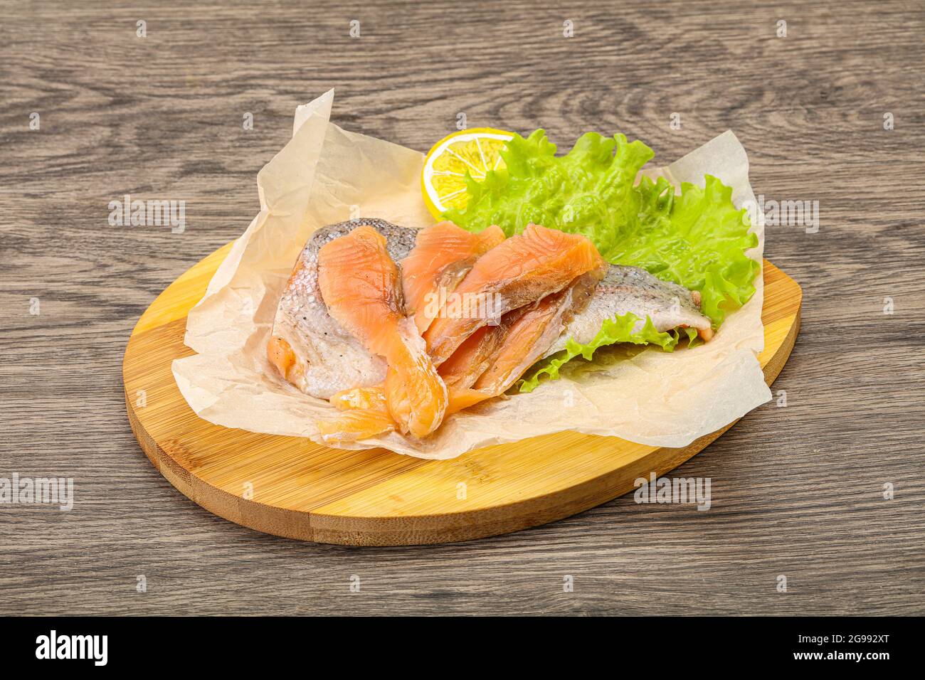 Sliced natural wild trout fillet over board Stock Photo - Alamy