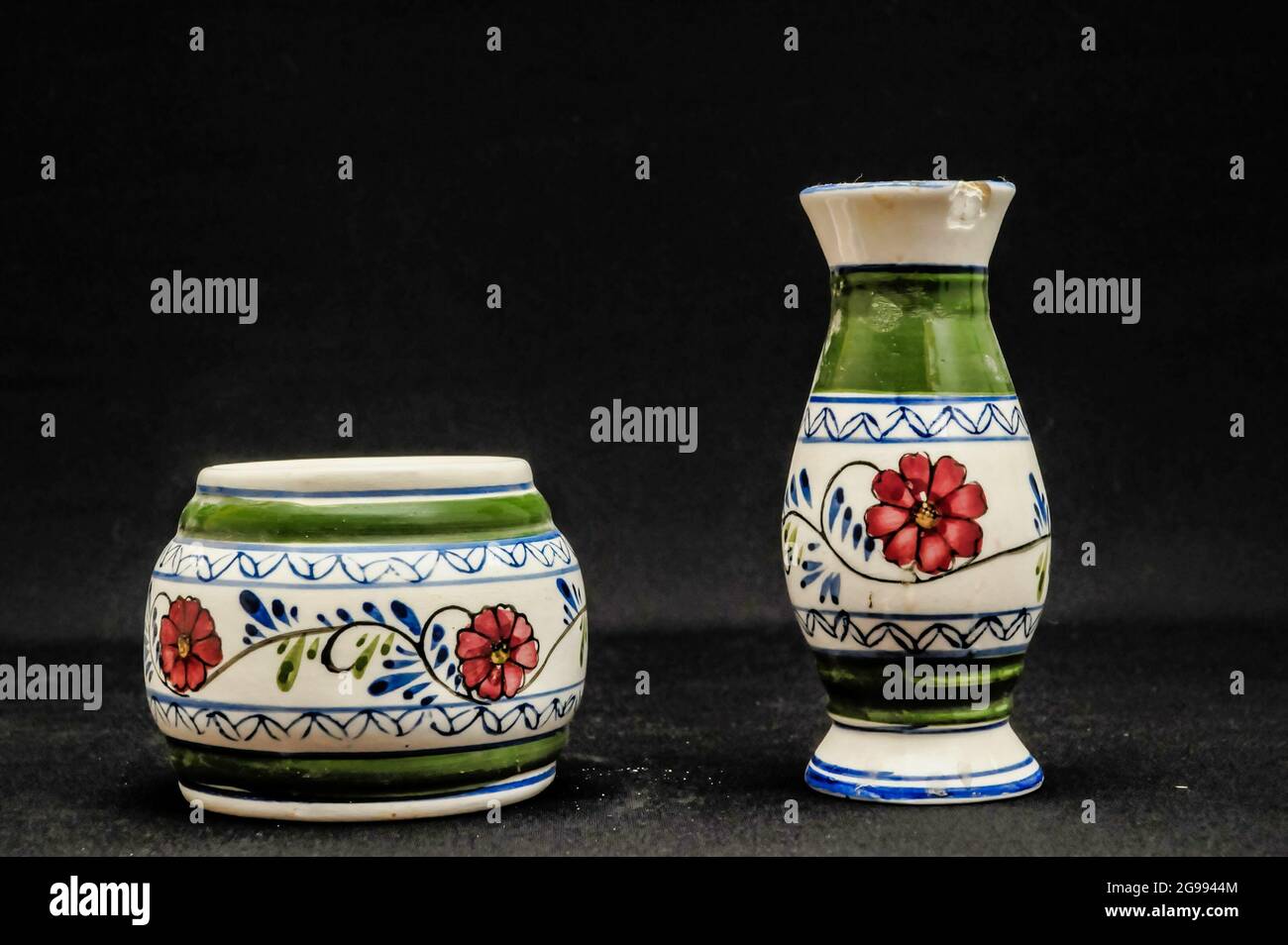 A shot of two cultural vases with different shapes next to each other ...