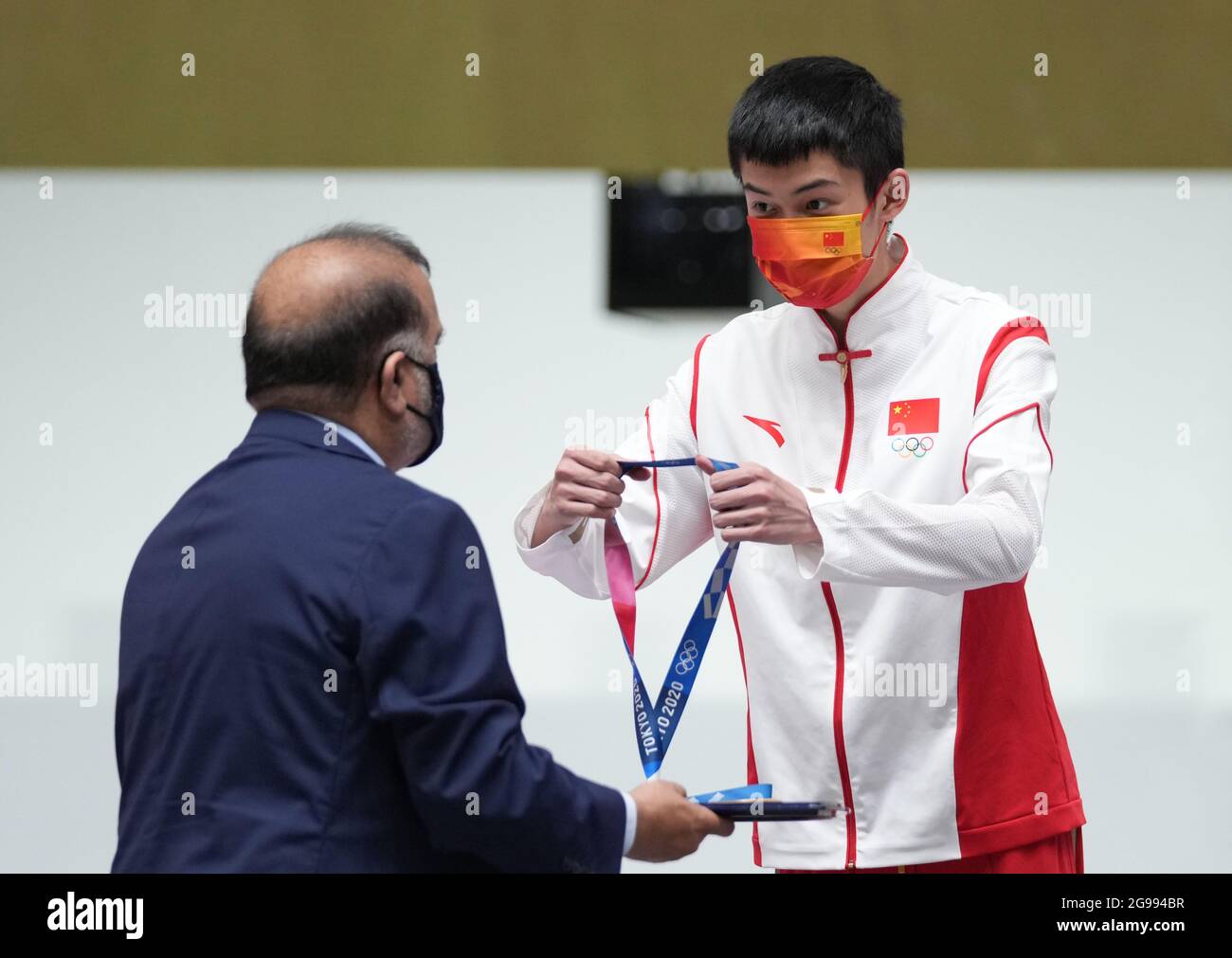Tokyo, Japan. 25th July, 2021. Sheng Lihao (R) of China react during ...