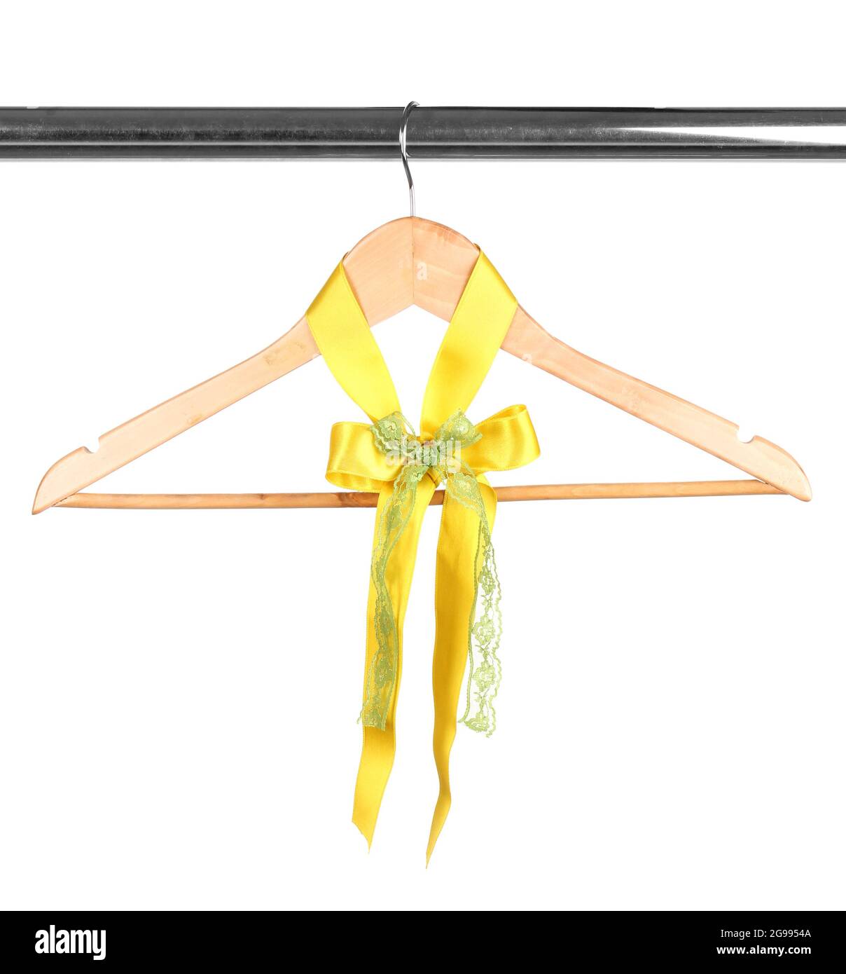 Beautiful yellow bow hanging on wooden hanger isolated on white Stock ...