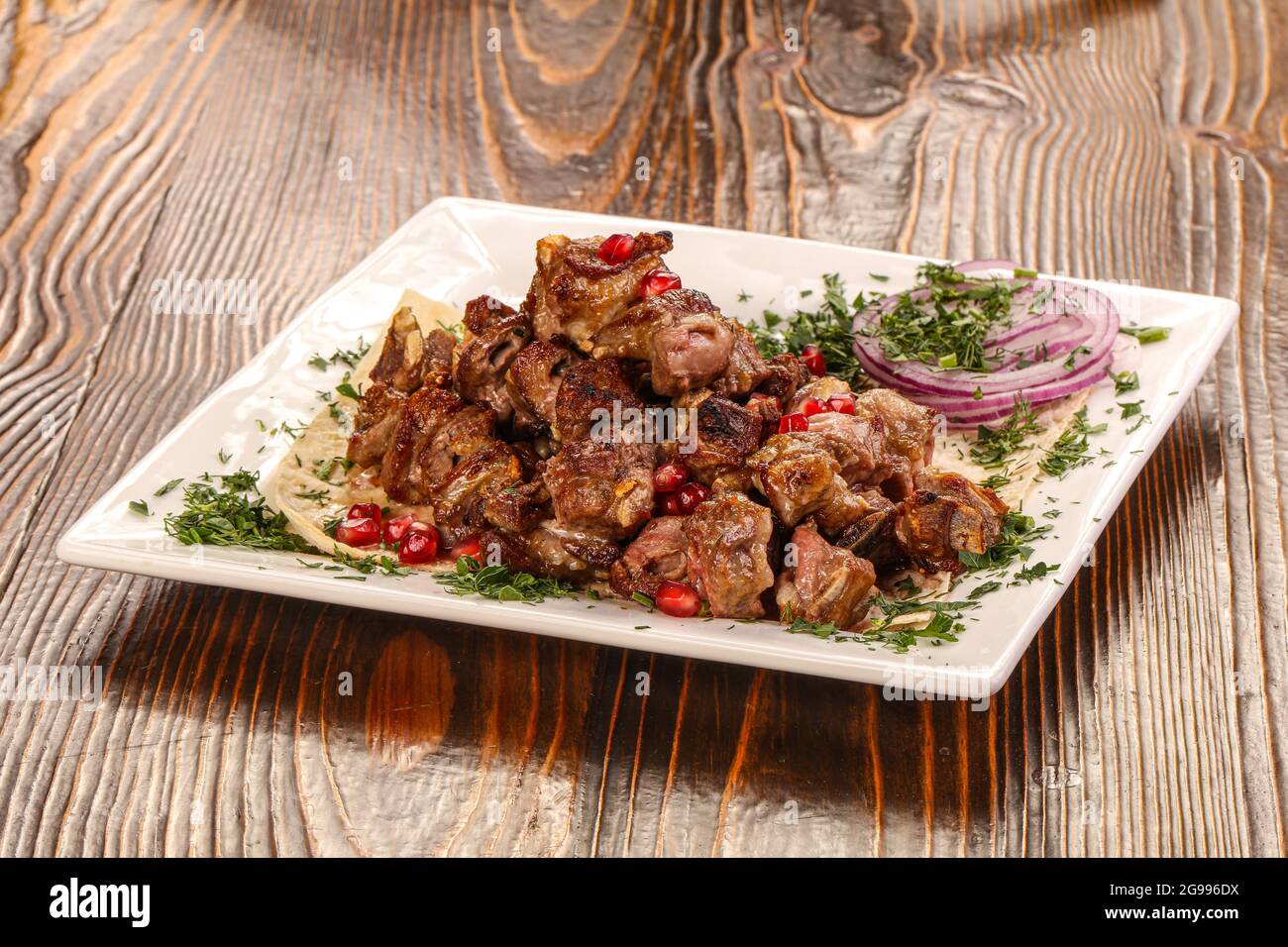 Lamb shashlik ribs seeds with herbs and onion Stock Photo - Alamy
