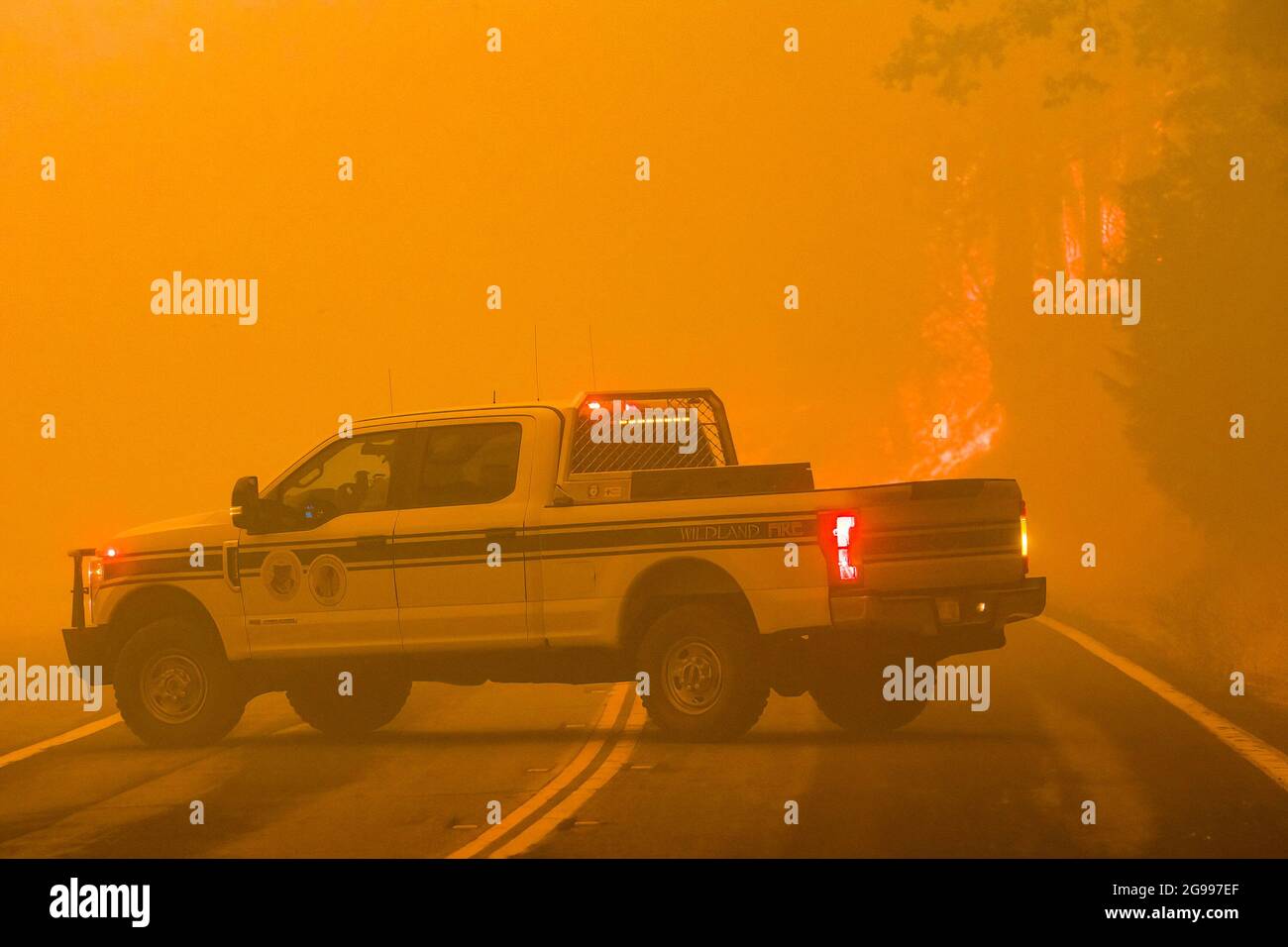Firefighter car turn around as active flames reach highway 70.The Dixie ...