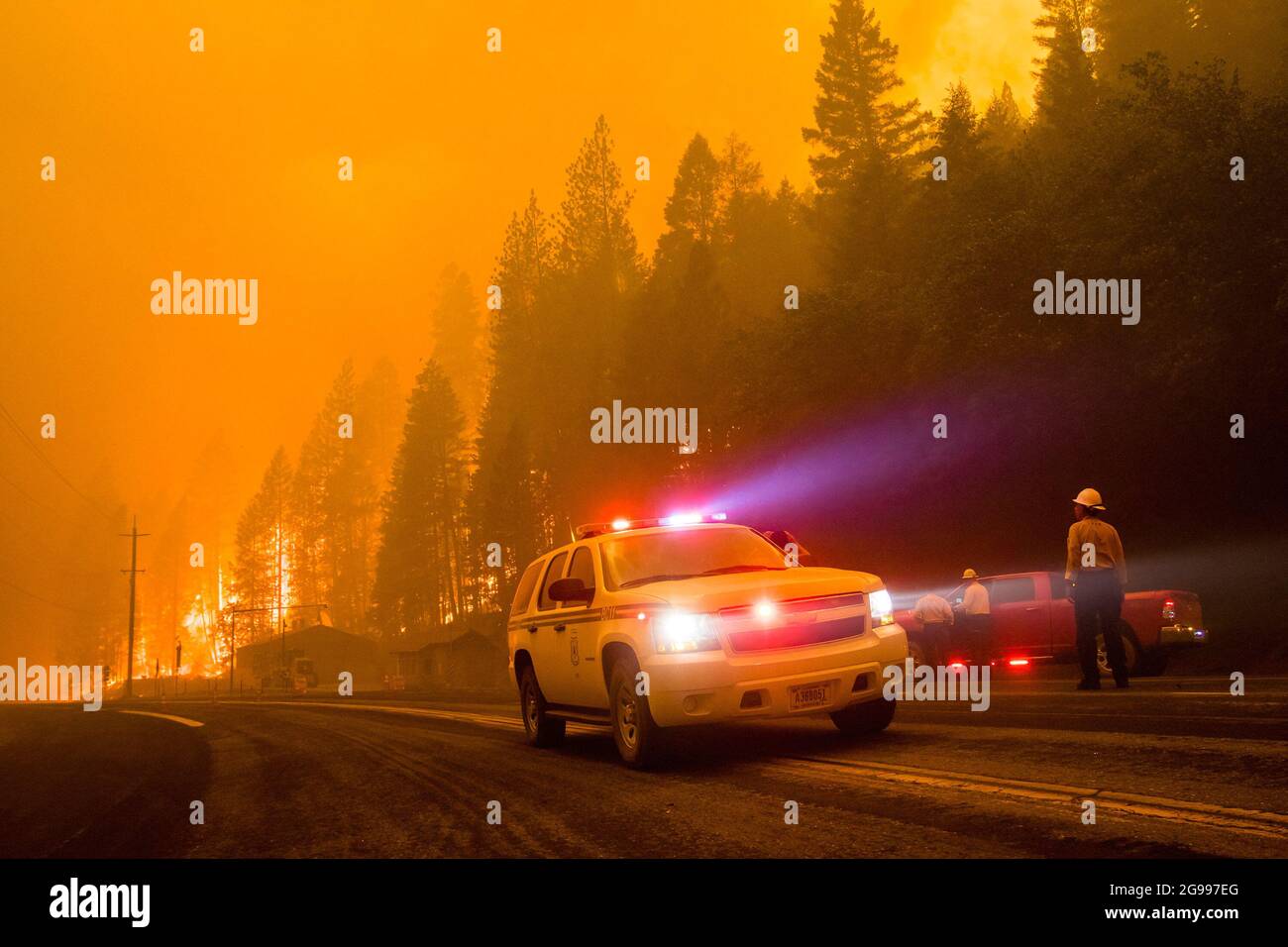Firefighter car turn around as active flames reach highway 70.The Dixie ...
