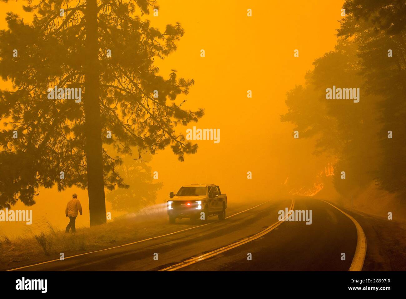 Firefighter car turn around as active flames reach highway 70.The Dixie ...