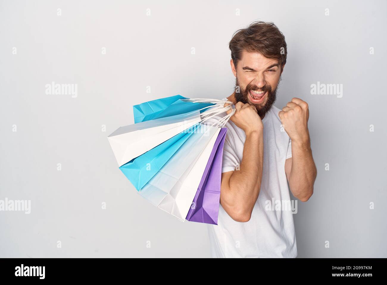 Man bags in teeth hi-res stock photography and images - Alamy