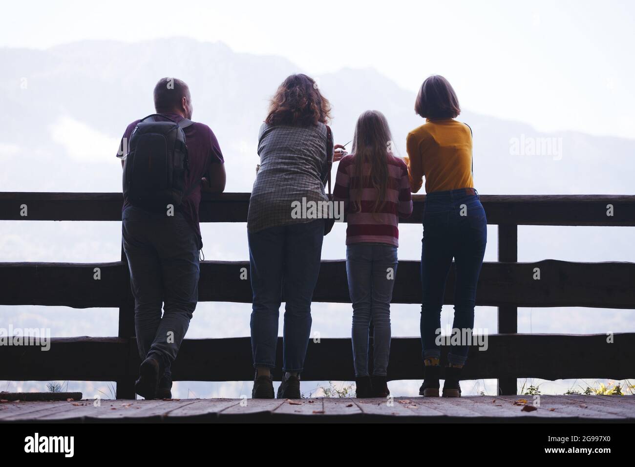 happy family on the observation deck and beautiful landscape in the ...