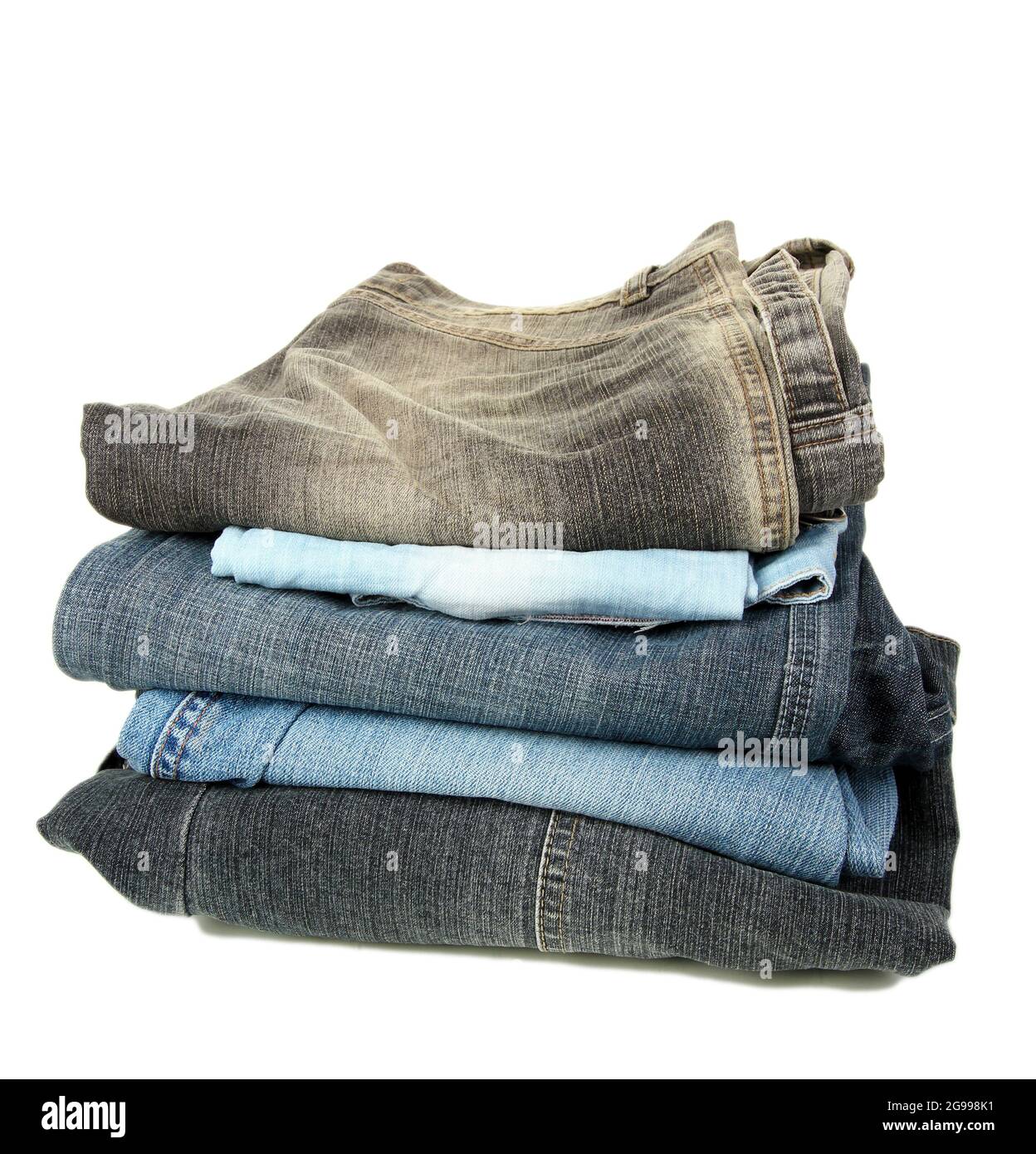 Lot of different jeans isolated on white Stock Photo - Alamy