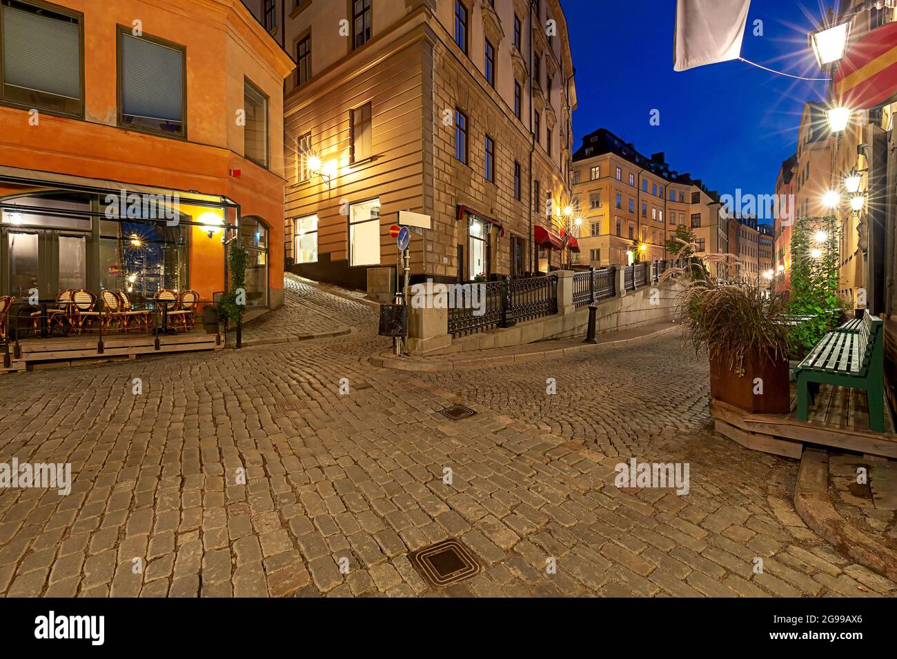 Old medieval street in the night illumination on the island Gamla Stan ...