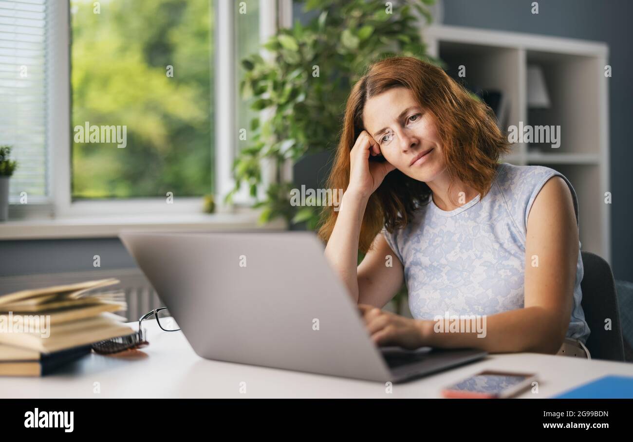 Woman dreaming at work Stock Photo - Alamy