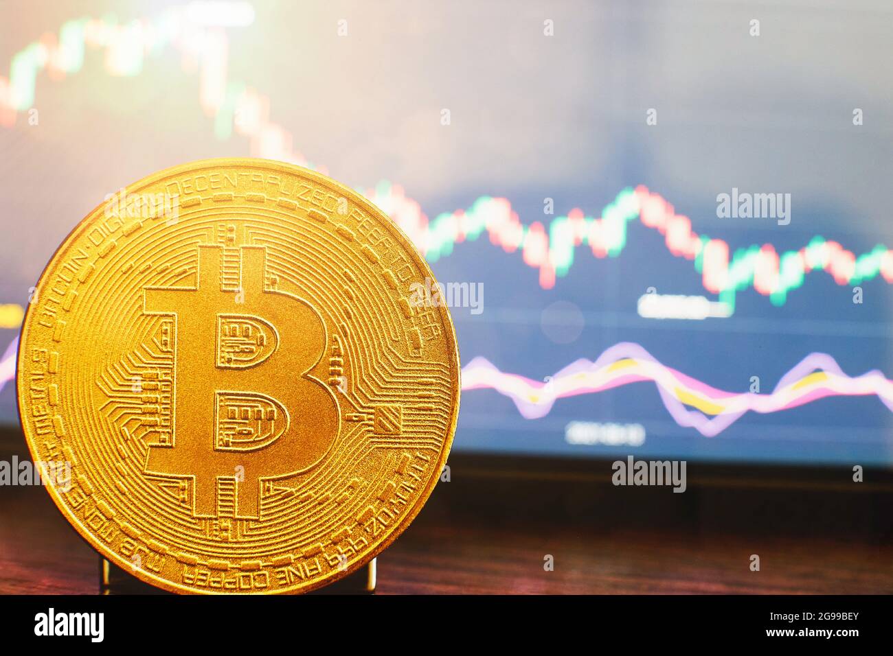Bitcoin on mining screen and trading chart hi-res stock photography and ...