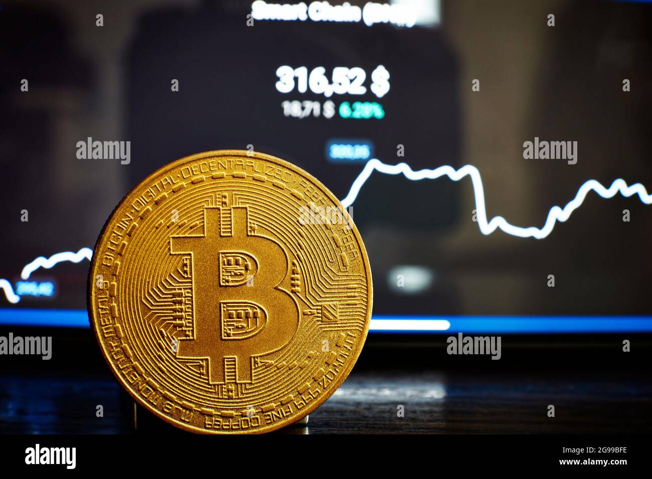 Bitcoin on mining screen and trading chart hi-res stock photography and ...