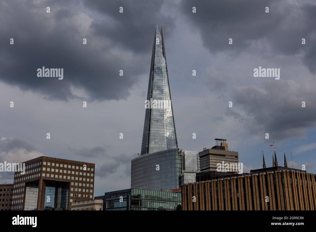 A low angle of high gray tower under misty foggy cloudy sky Stock Photo ...