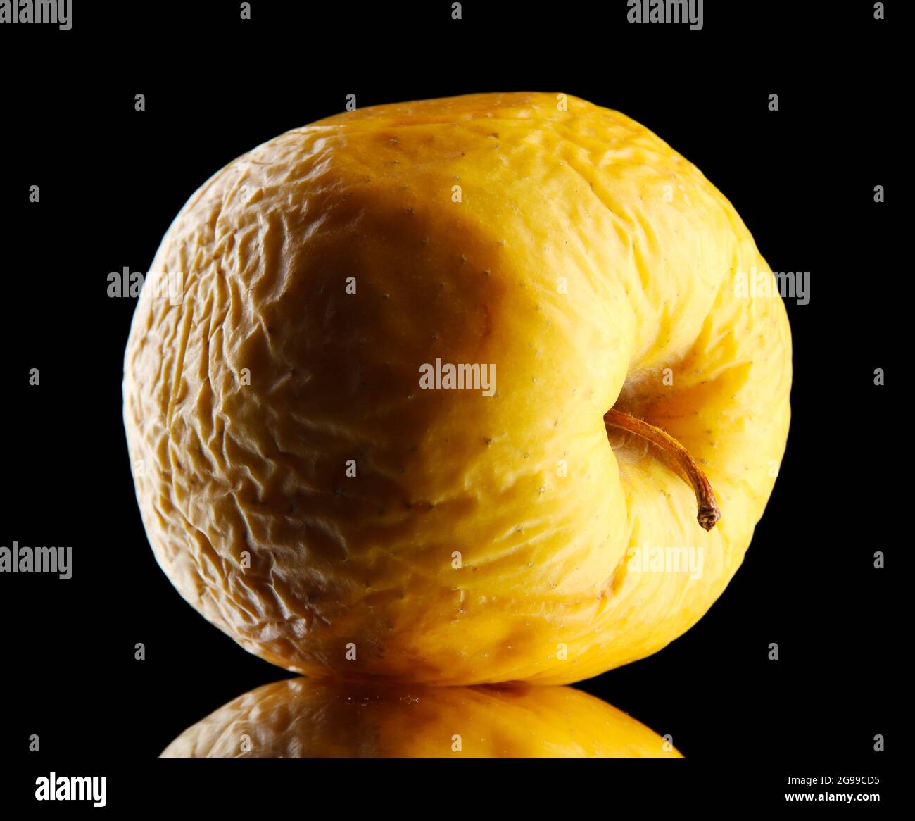 Yellow apple as problem skin concept, on black background Stock Photo ...