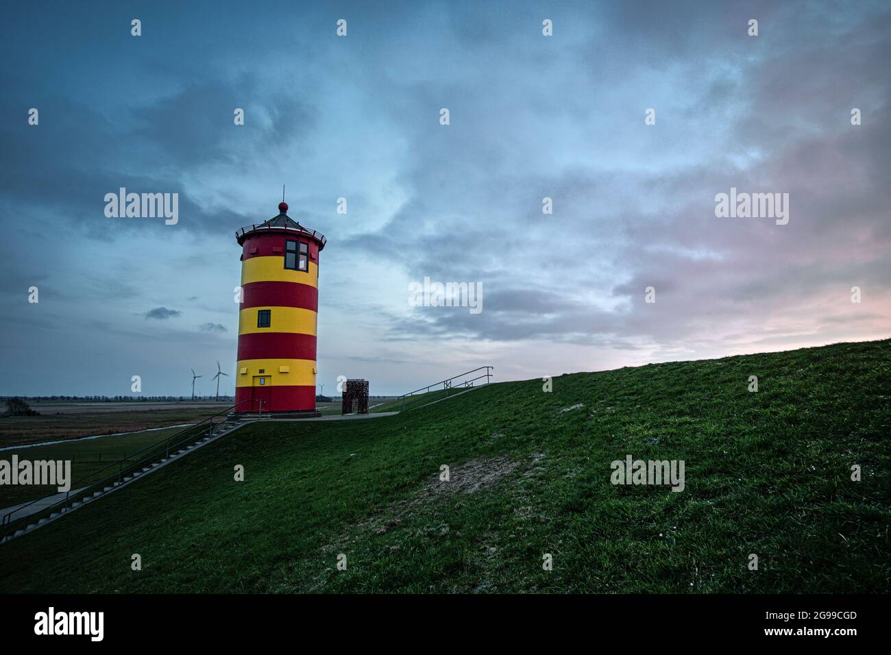 A scenic view of the Pilsum lighthouse in Krummhorn, Germany Stock ...