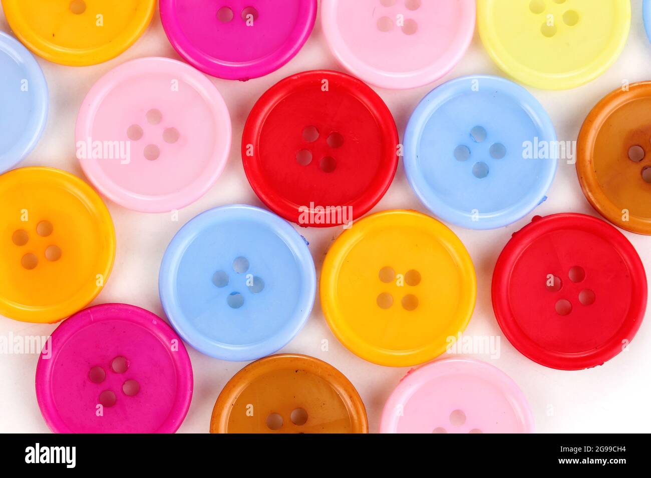 Colorful sewing buttons isolated on white Stock Photo - Alamy