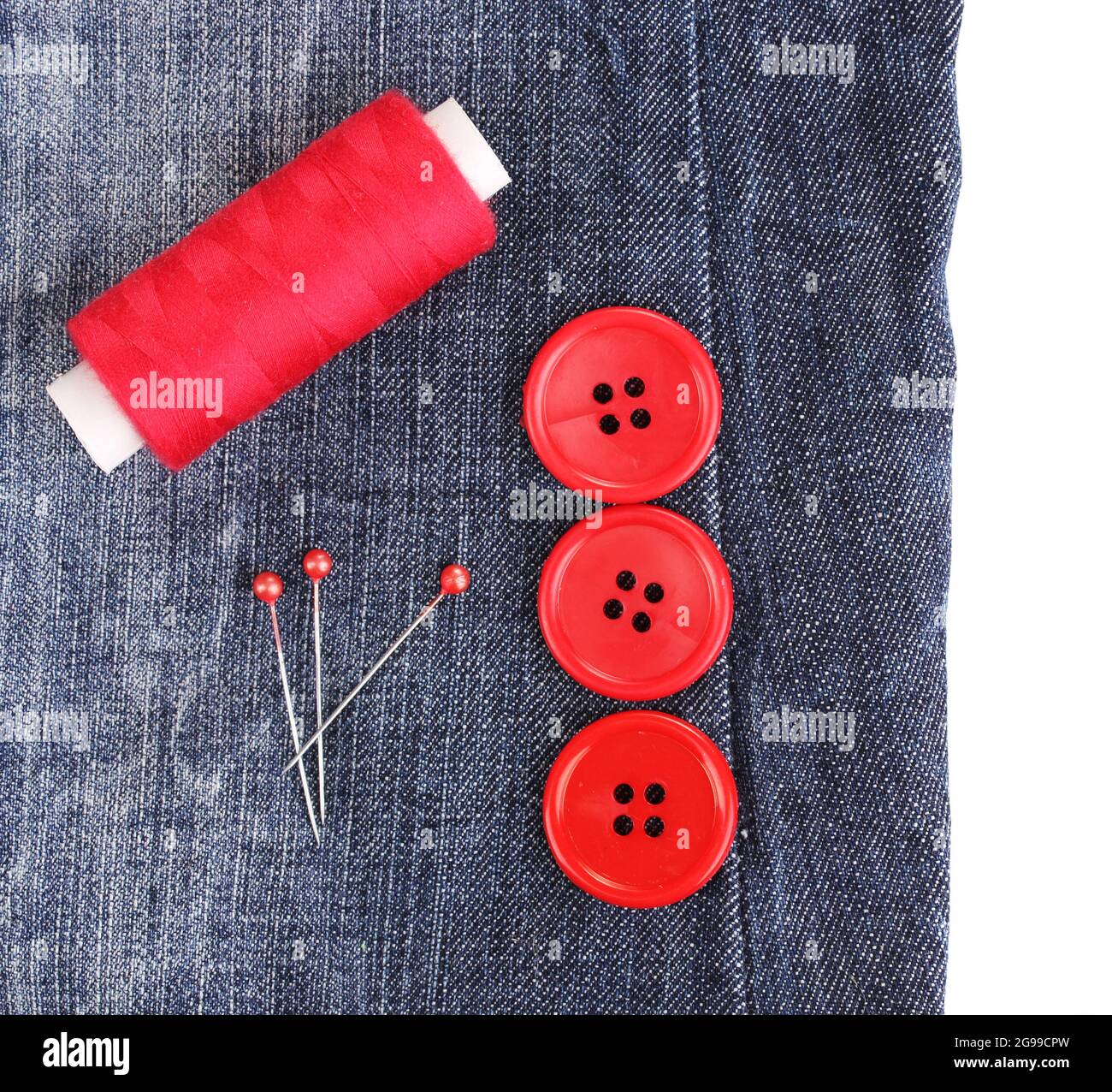 Colorful sewing buttons with thread on jeans isolated on white Stock ...