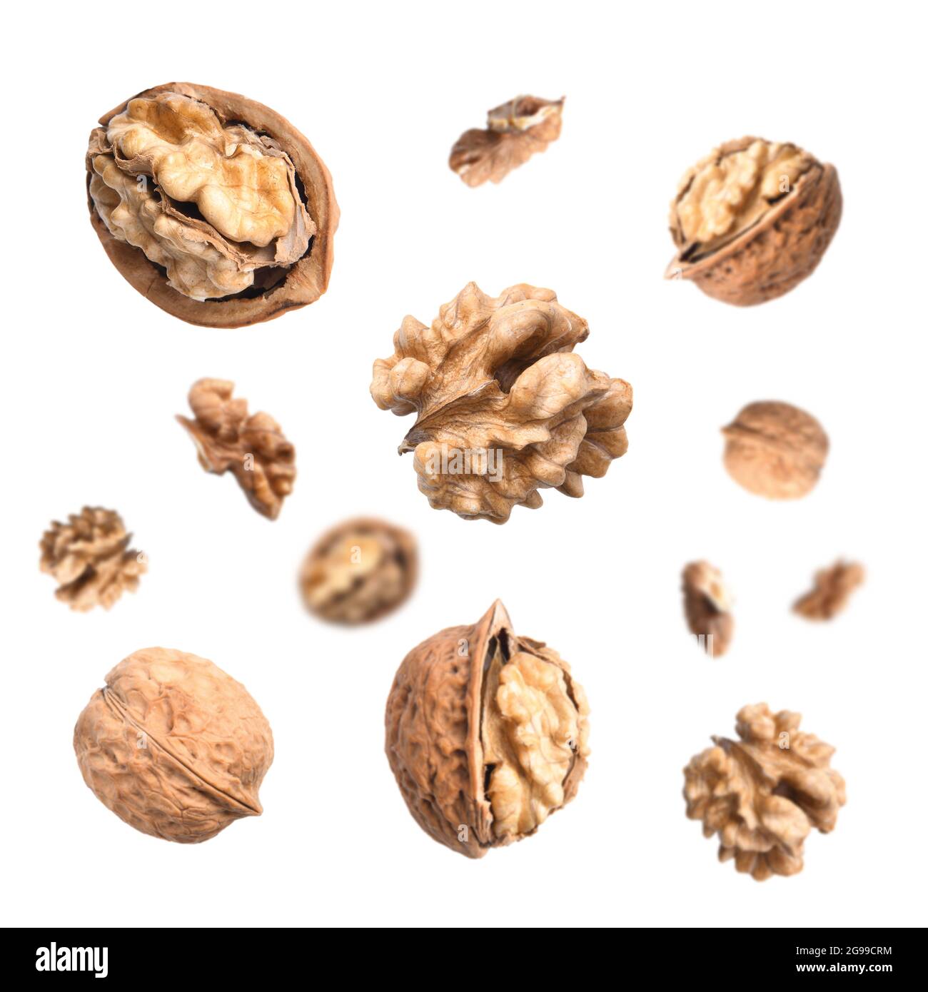 Falling walnuts isolated on white background Stock Photo - Alamy