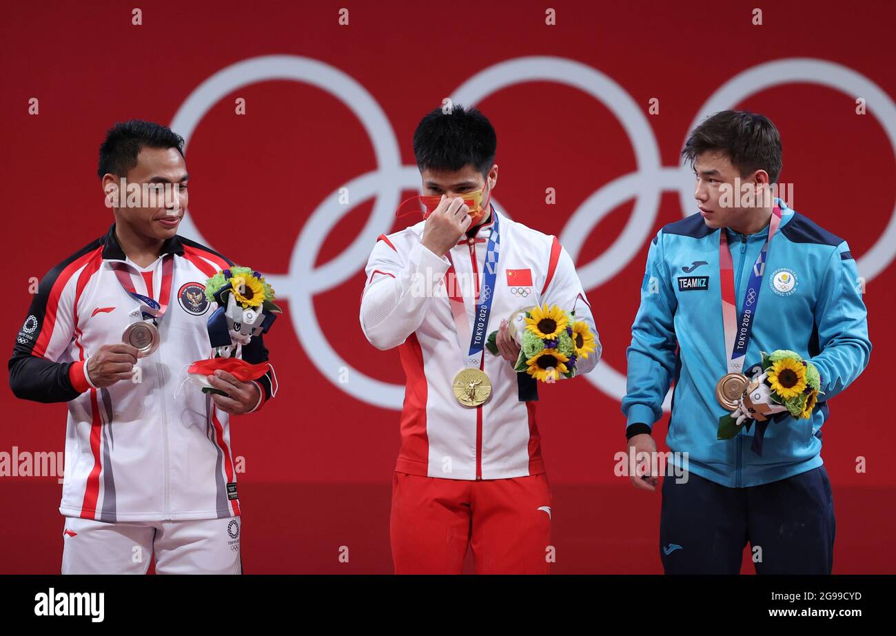 Tokyo, Japan. 25th July, 2021. Li Fabin (C) of China poses with Eko ...