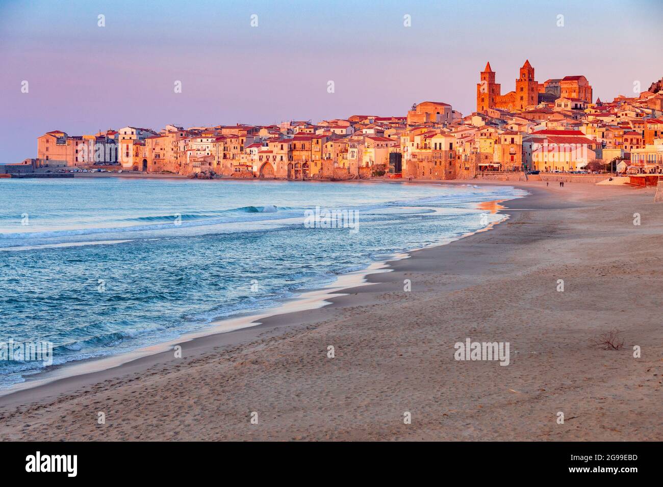City embankment in the old medieval town Cefalu at sunset. Italy ...