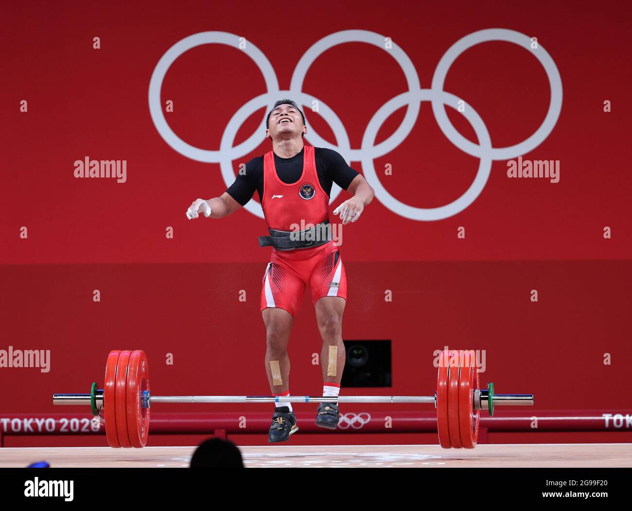 Tokyo, Japan. 25th July, 2021. Eko Yuli Irawan of Indonesia celebrates ...