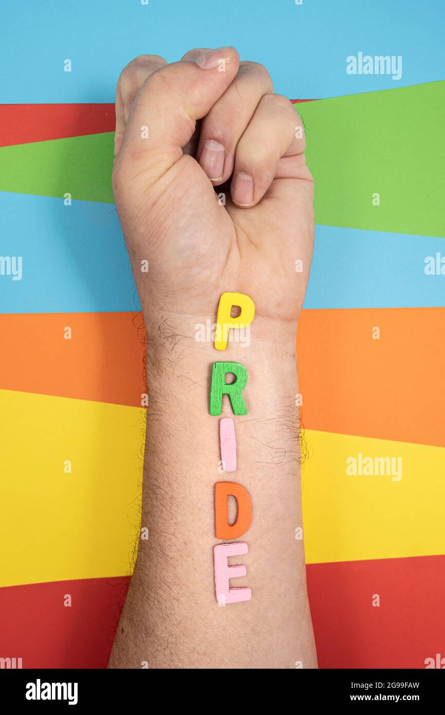 an arm with a closed fist with the multicolored inscription Pride Stock ...