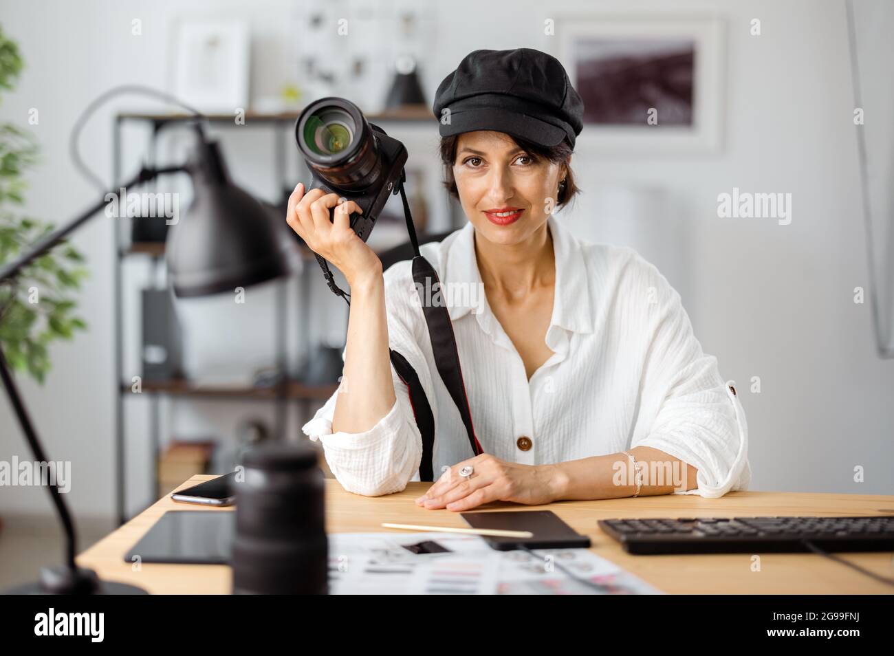 Portrait photographer sitting table hi-res stock photography and images ...