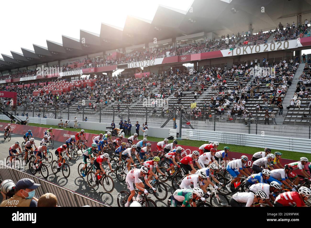 Tokyo, Japan. 24th July, 2021. The field of drivers in action, cycling ...
