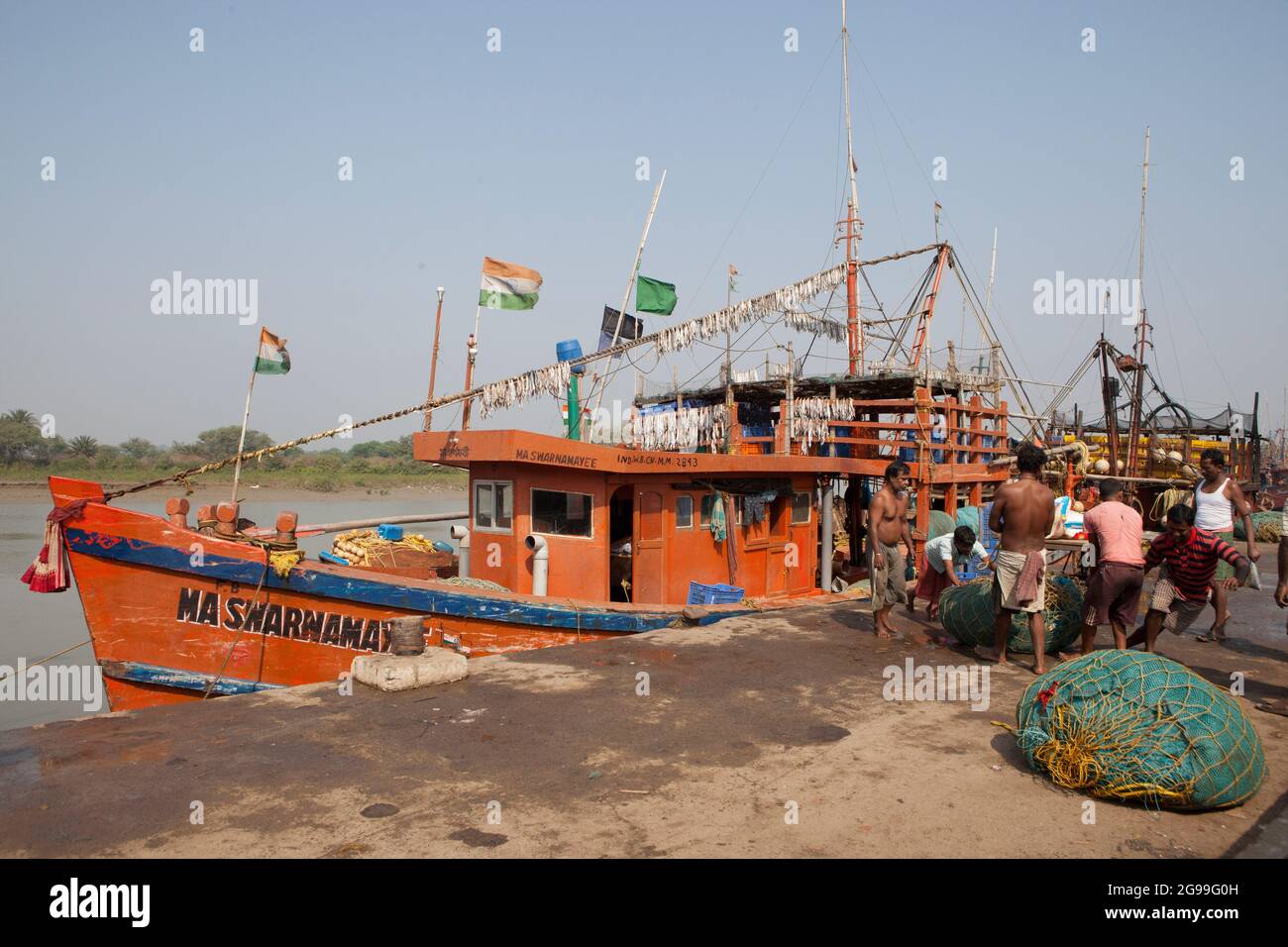 fish are being dried in sunlight to prepare sundry fish in trawlers ...