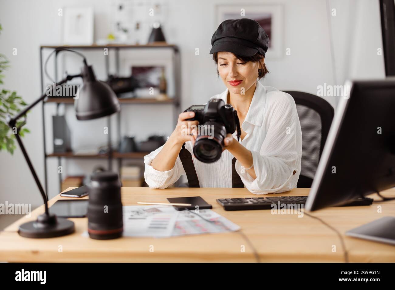 Photographer working at office Stock Photo - Alamy