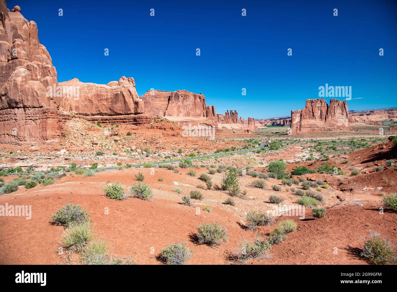 Amazing canyon of red rocks and small bushes Stock Photo - Alamy