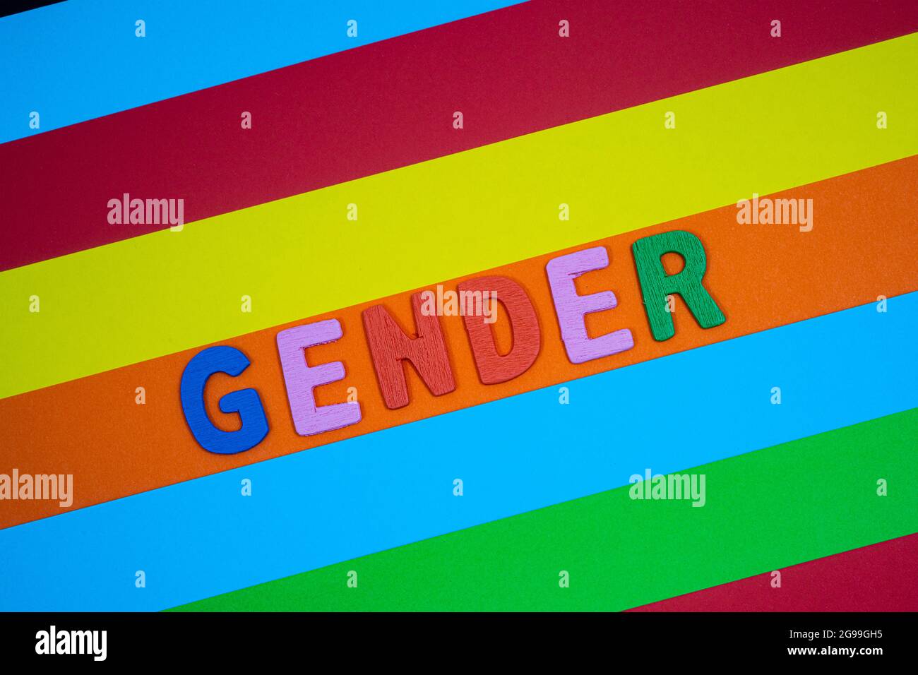 the word Gender on a surface with some colored stripes to form a ...