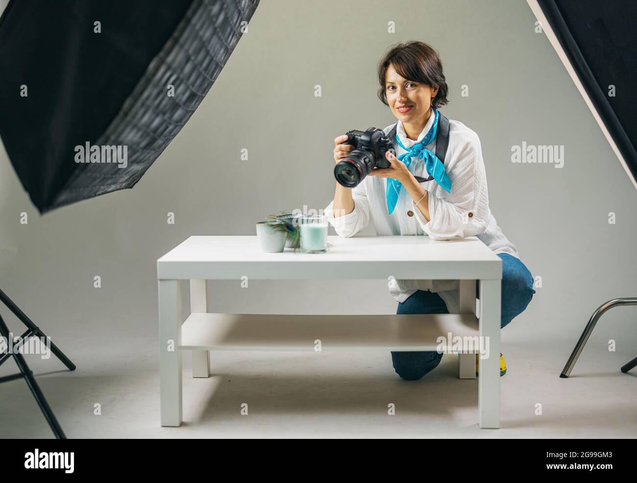 Photographer taking creative photos at studio Stock Photo - Alamy