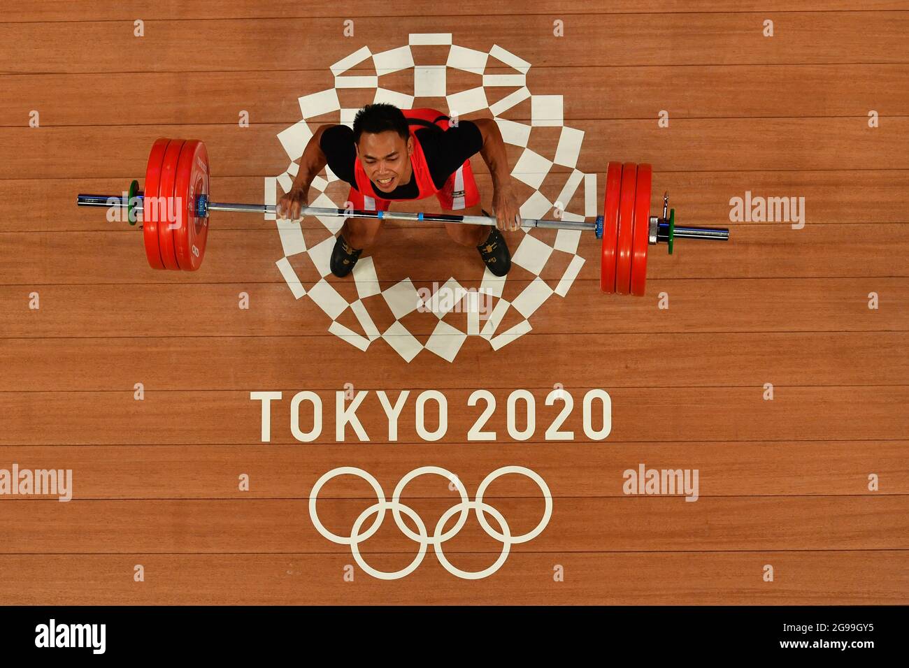 Tokyo, Japan. 25th July, 2021. Eko Yuli Irawan of Indonesia competes ...