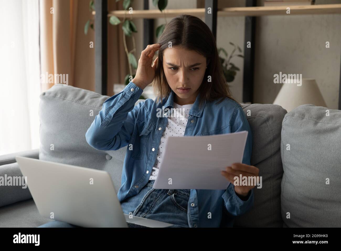 Worried woman reading bank statement hi-res stock photography and ...