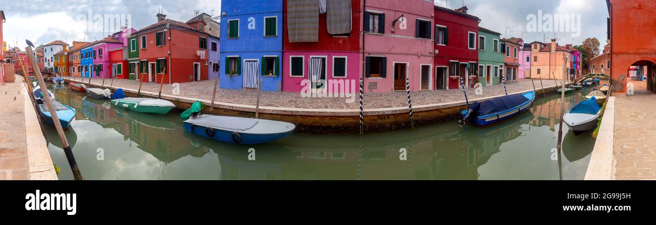 Panoramic view of colorful houses along the canal on the island of Burano. Burano. Italy. Venice ...