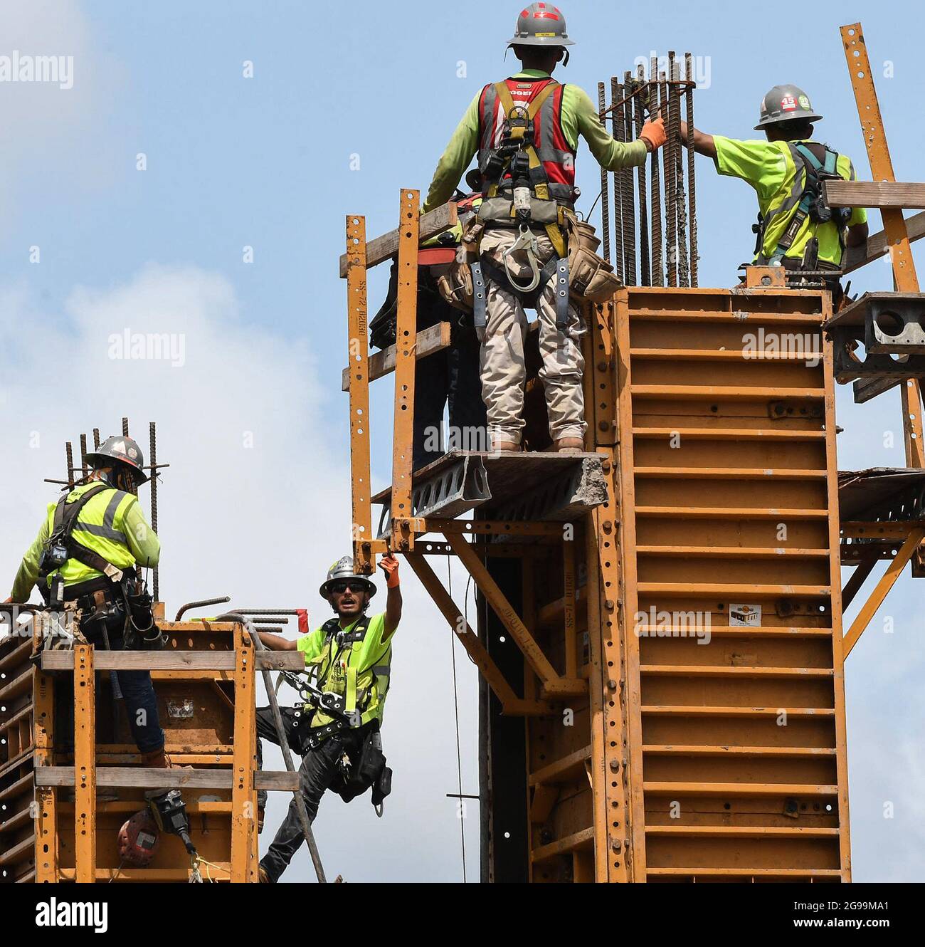 Workers are seen as construction progresses on the largest residential ...