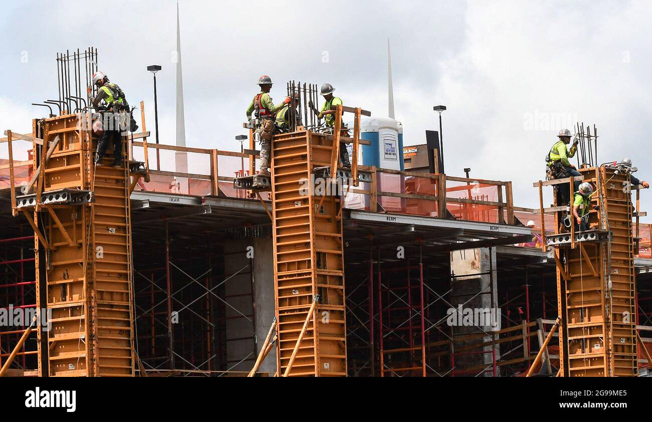 Workers are seen as construction progresses on the largest residential ...