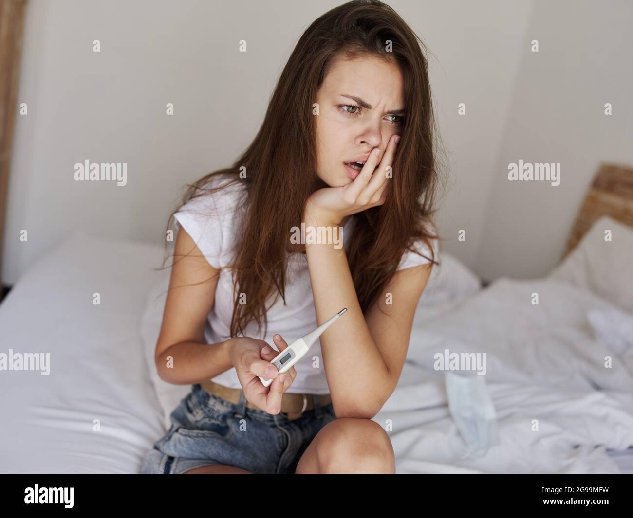 frustrated woman with thermometer hands high temperature health ...