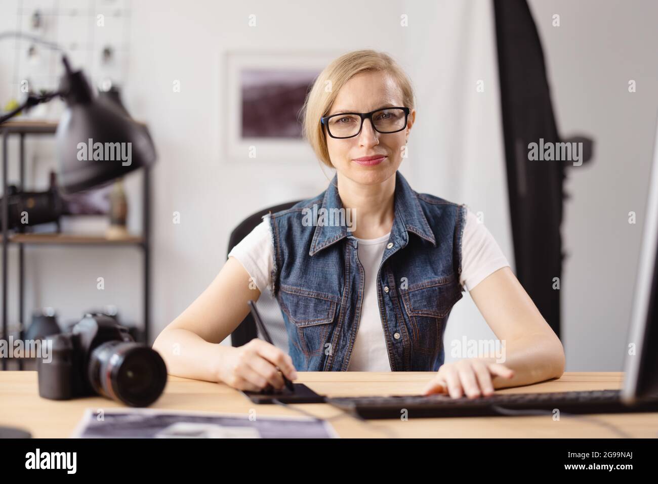 Female photographer editing pictures Stock Photo - Alamy