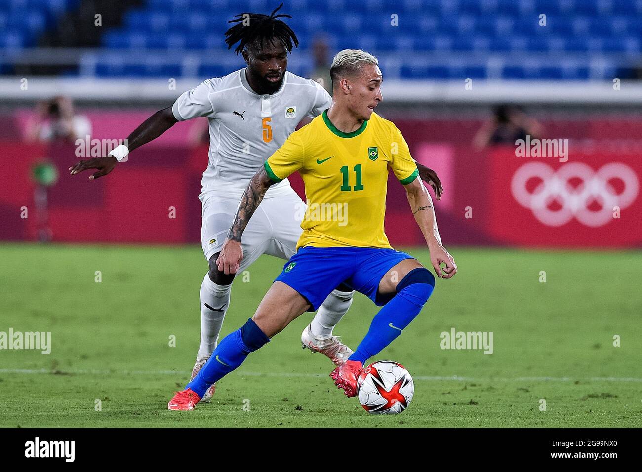 YOKOHAMA, JAPAN - JULY 25: Ismael Diallo of Ivory Coast and Richarlison ...