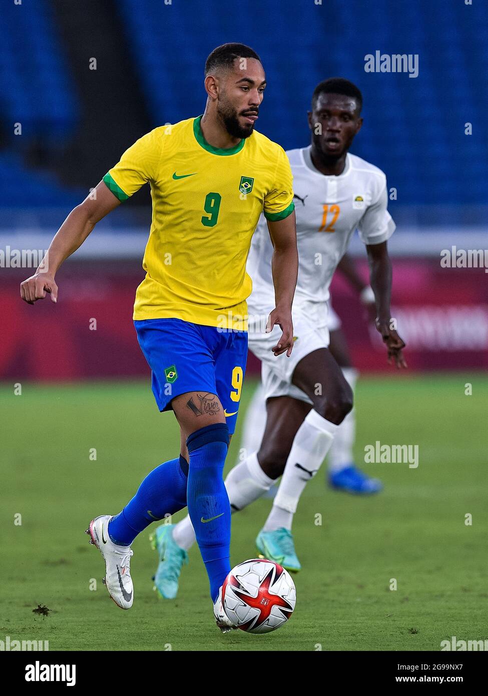 YOKOHAMA, JAPAN - JULY 25: Matheus Cunha of Brazil and Eboue Kouassi of ...